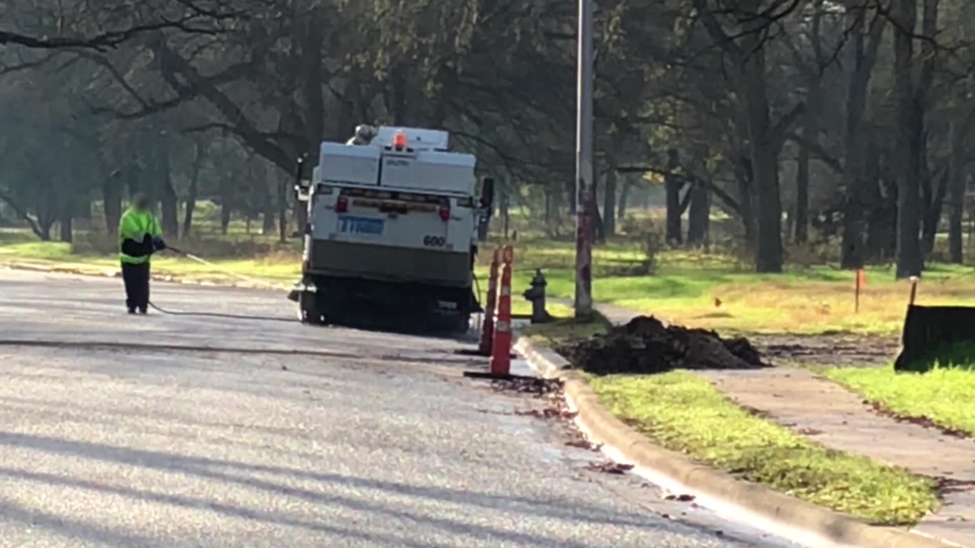 KXAN shot video of a street sweeper operator spraying waste directly ...