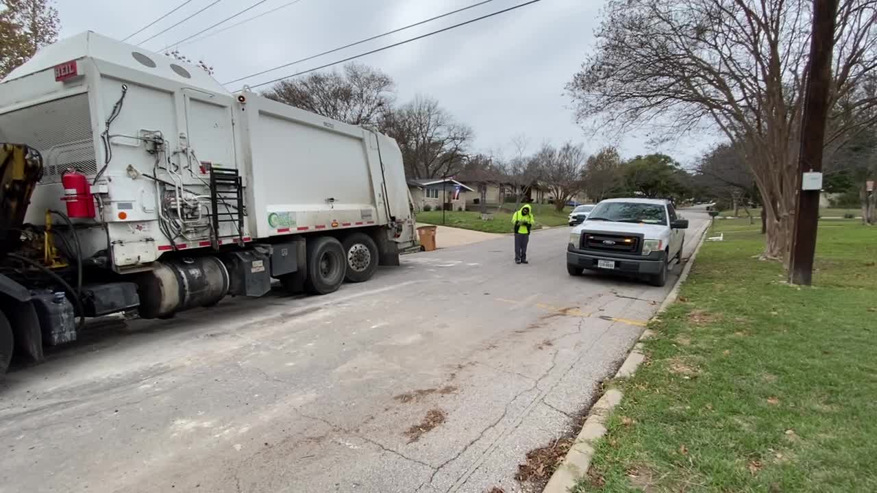 Pothole in northeast Austin neighborhood causes garbage truck to get ...
