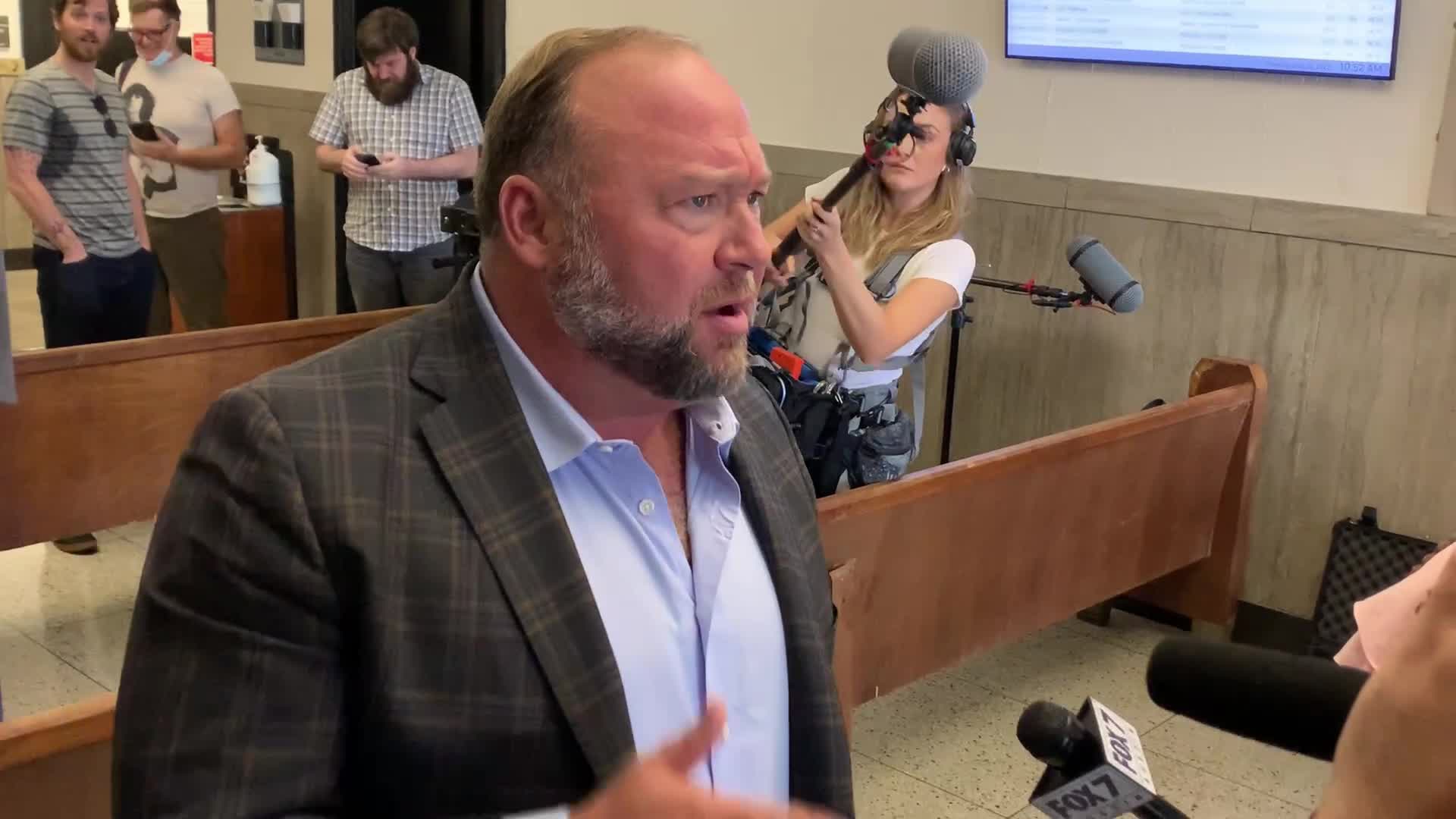 Alex Jones speaks to reporters outside of court Tuesday – KXAN Austin