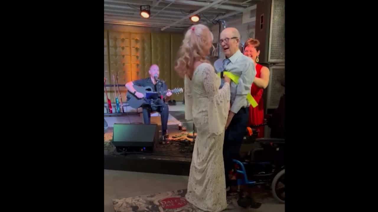 Mark Maloney dancing in the father-daughter dance with his, caregiver, Kimberly Gustafson at her ...