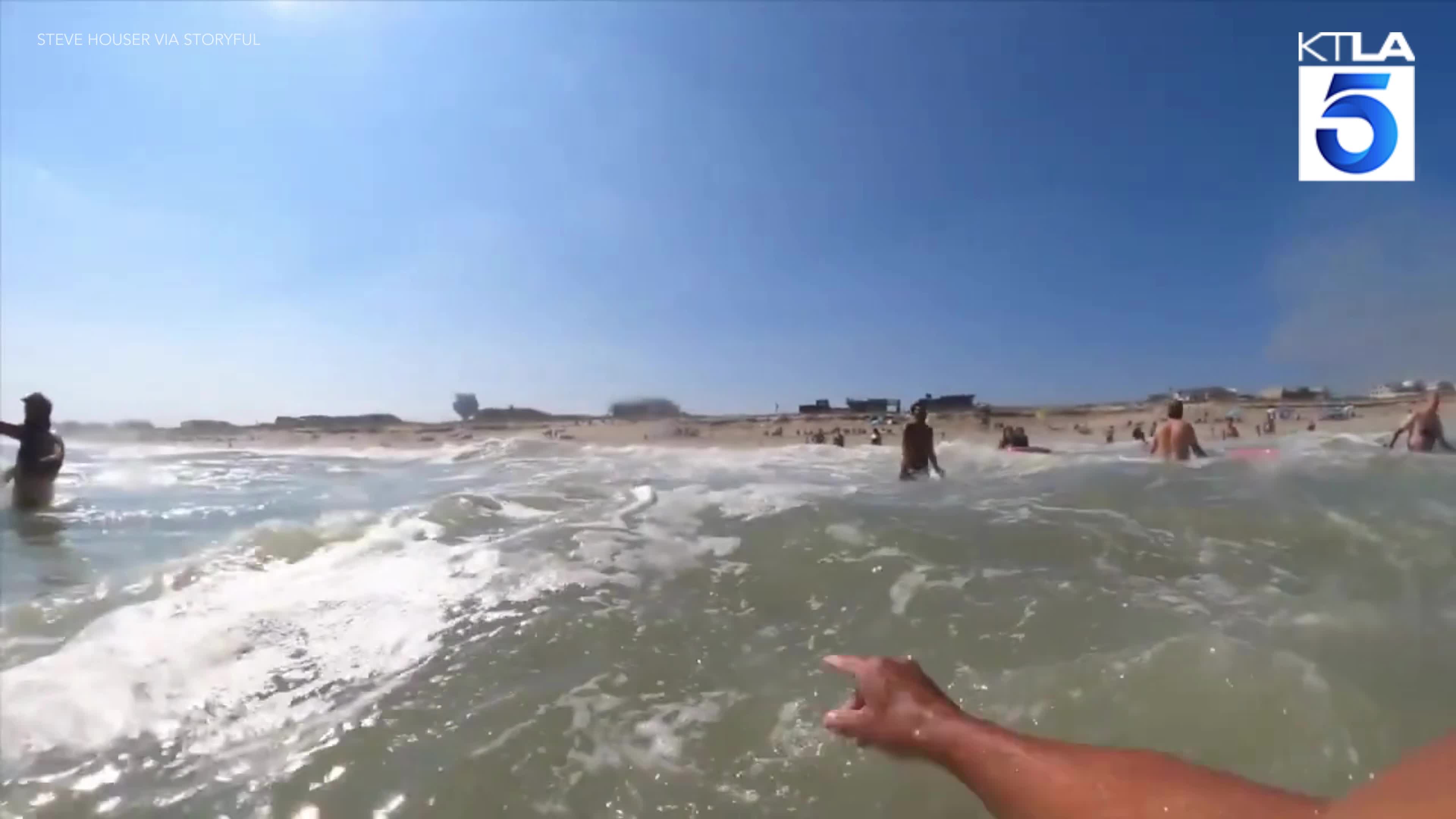 Video shows swimmer rescued from potentially deadly rip current – KTLA
